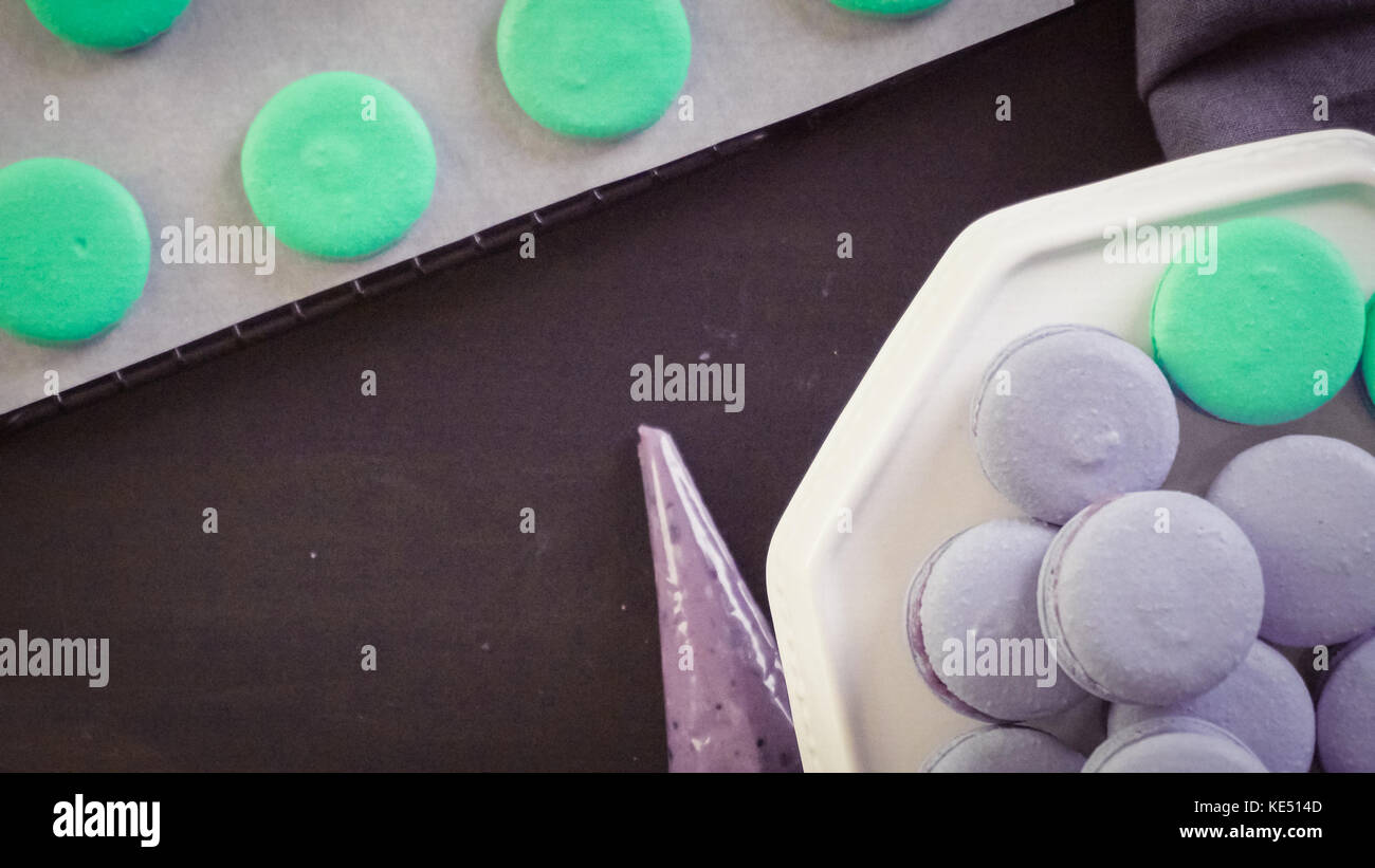 Step by step. Filling french marcarons with purple cream Stock Photo ...