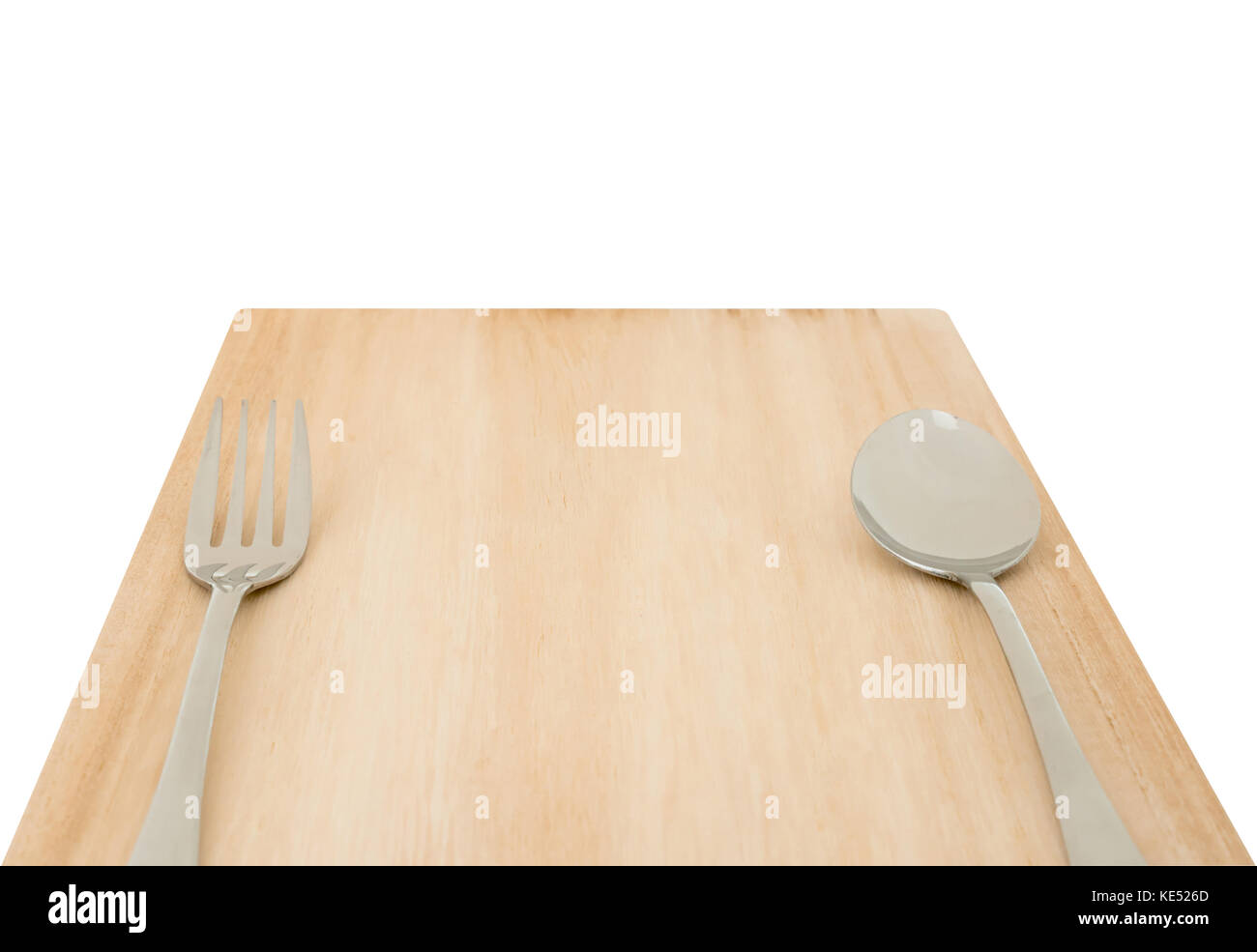 Wood cutting board and set of fork and spoon isolated on white ...