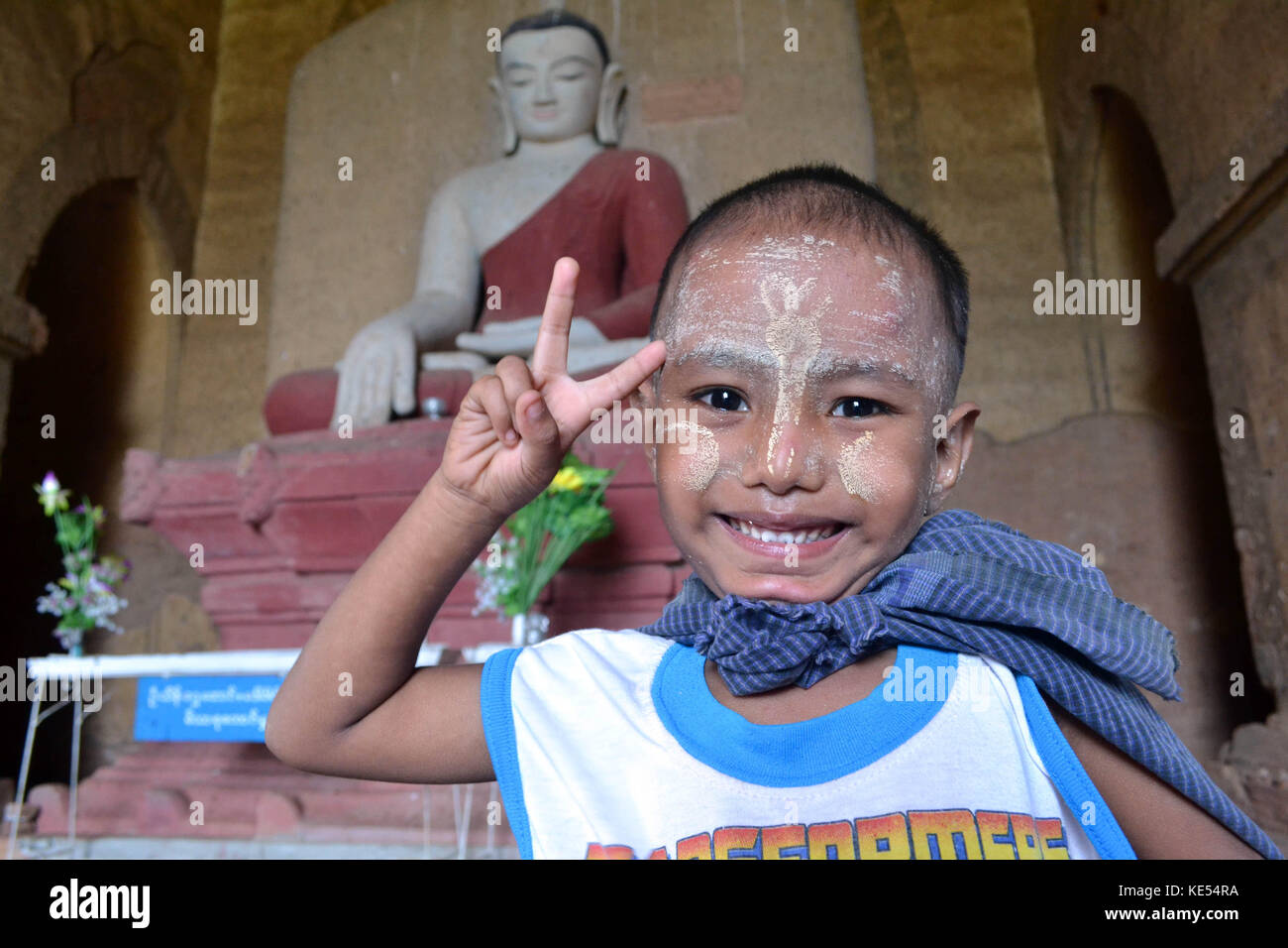 A child doing pose around Bagan Archaeological Zone, Myanmar. It's a ...