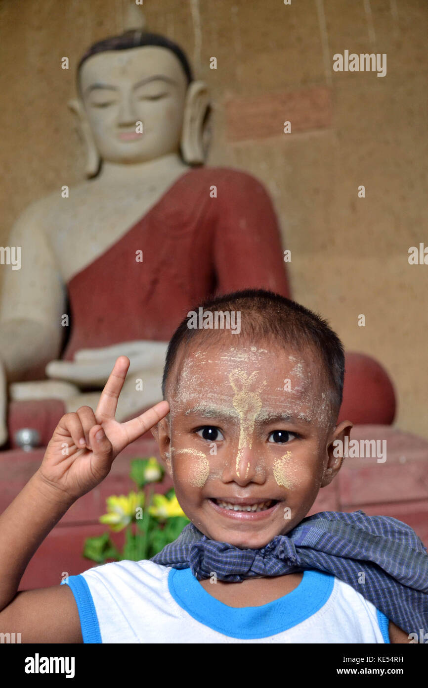 A child doing pose around Bagan Archaeological Zone, Myanmar. It's a ...