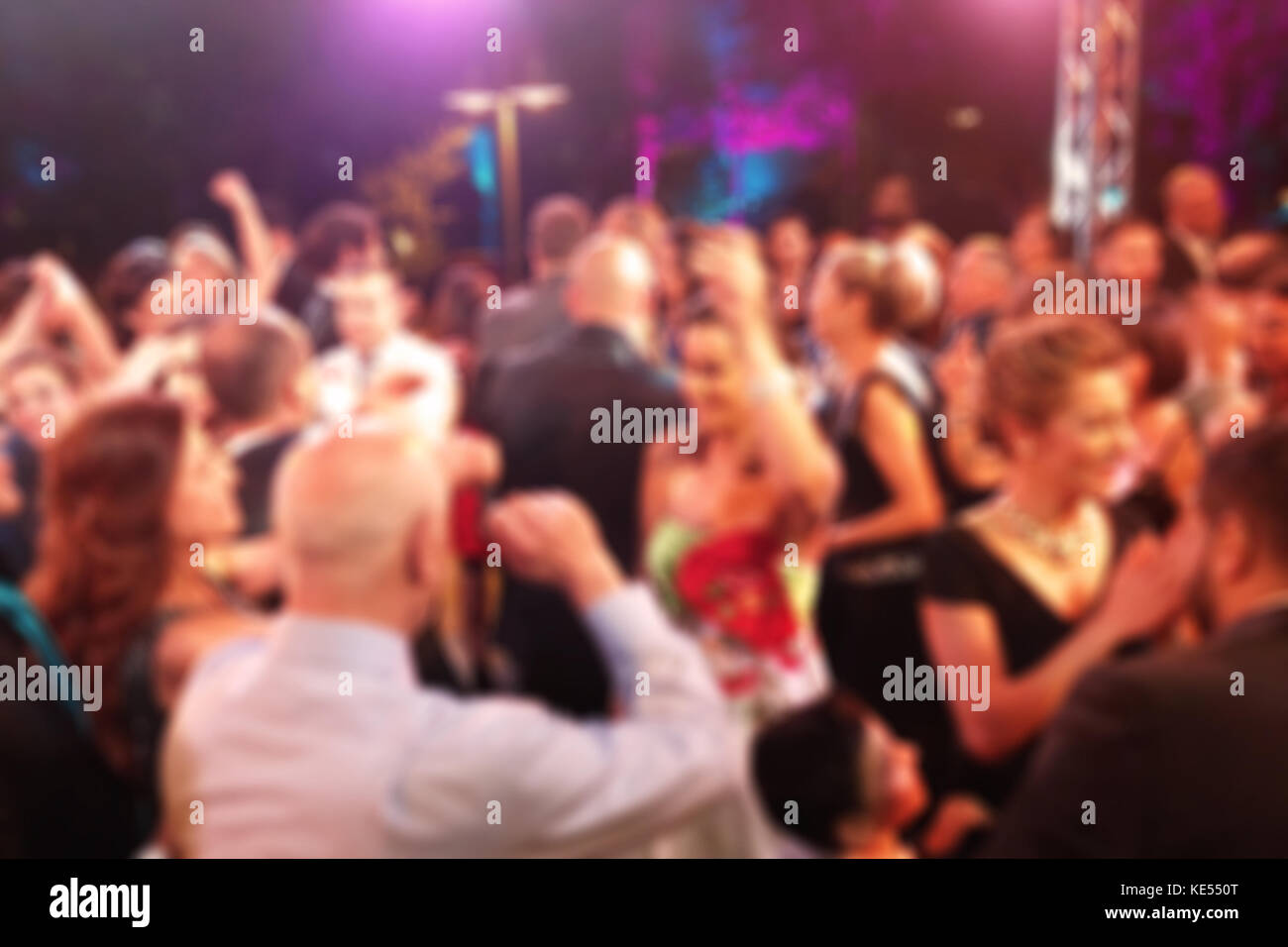Blurred background with people in a night dancing party Stock Photo - Alamy