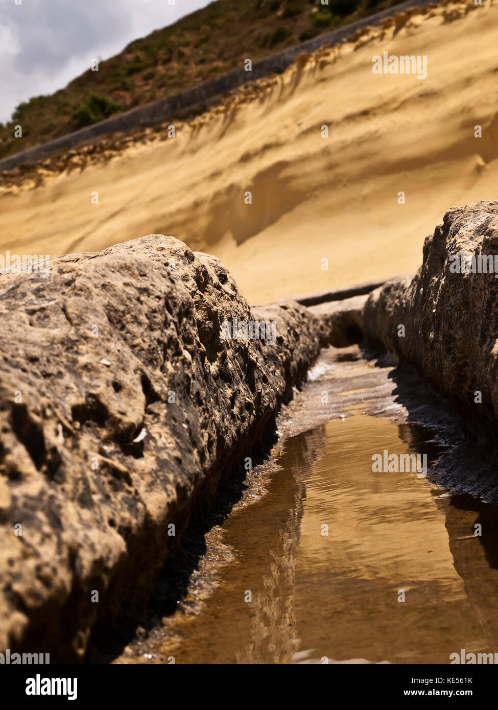 Image shot through rut carved in stone giving impression of a valley ...