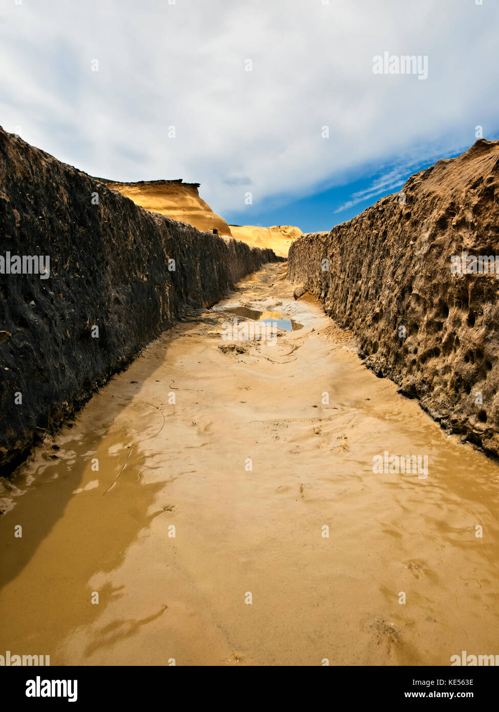 Image shot through rut carved in stone giving impression of a valley ...