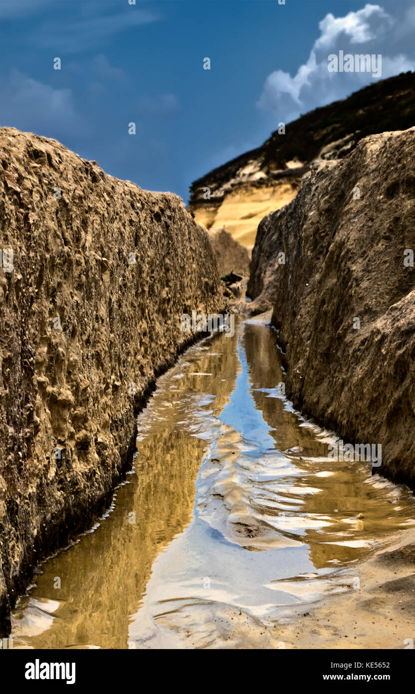 Image shot through rut carved in stone giving impression of a valley ...