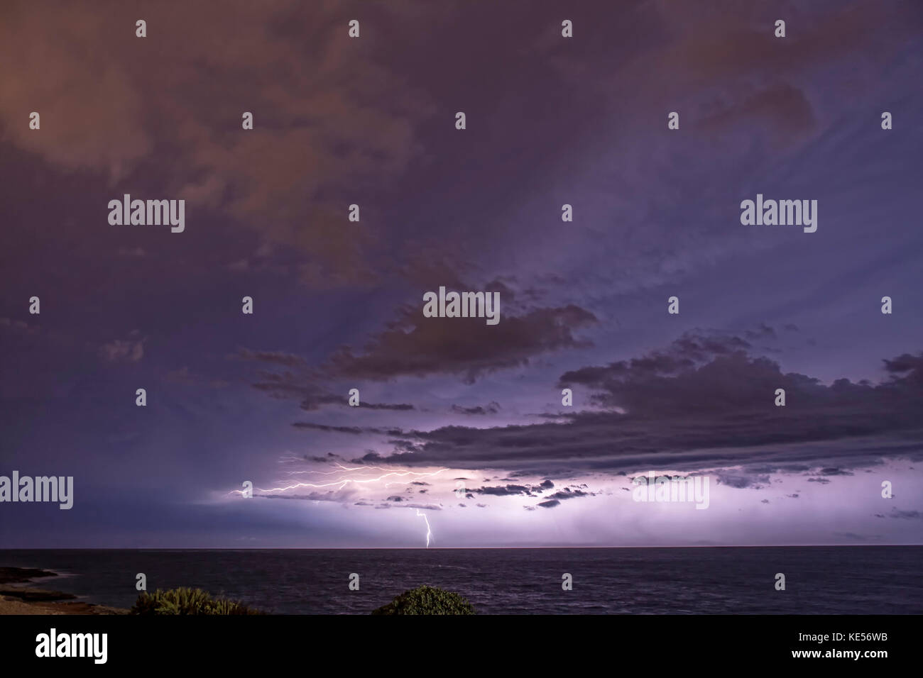 Lightning bolt and storm clouds over the horizon at Zonqor Point in ...