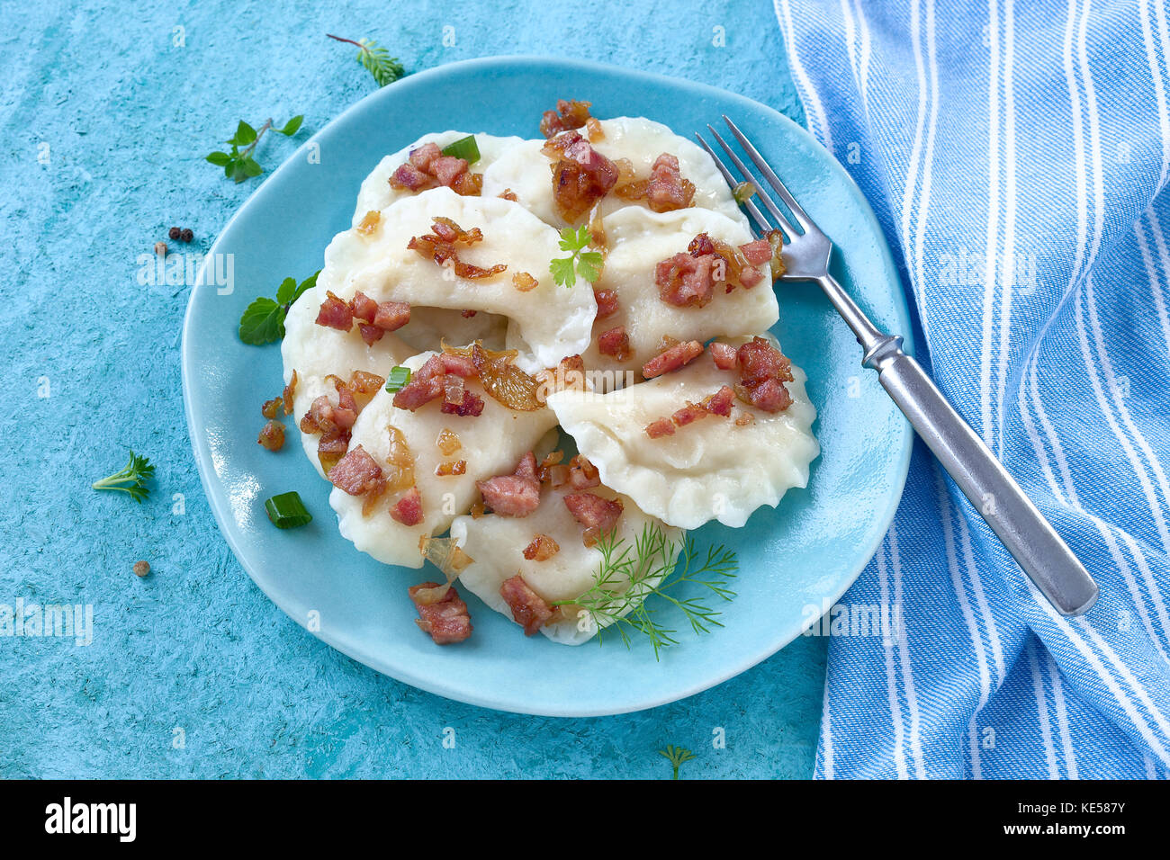 Fried piroggi with bacon and onion Stock Photo - Alamy