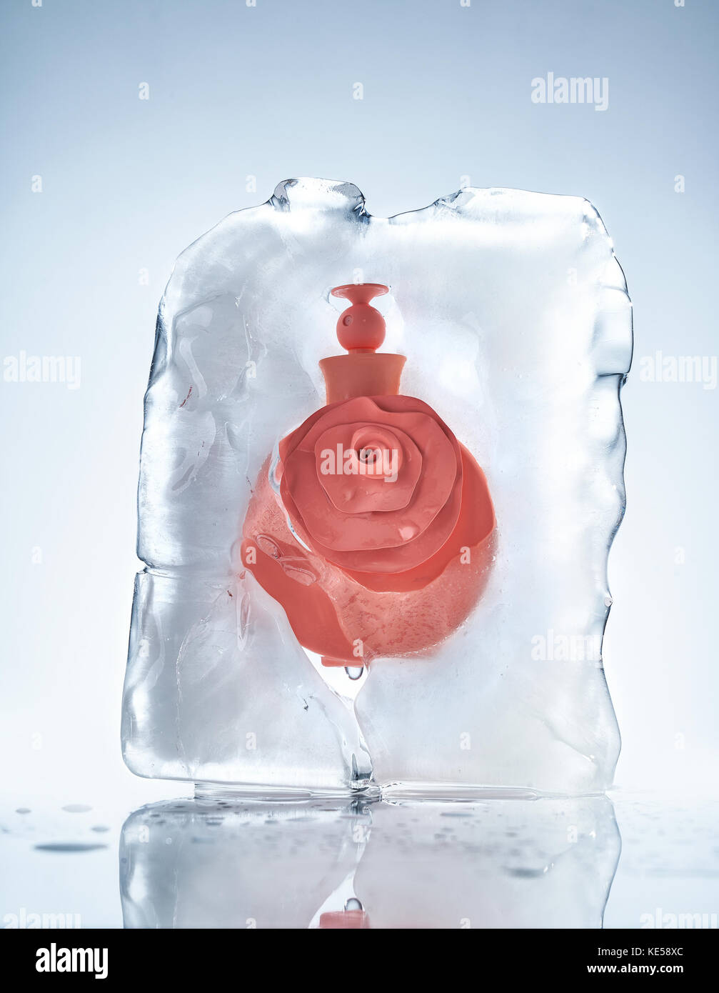 Luxurious perfume frozen in a piece of ice Stock Photo - Alamy