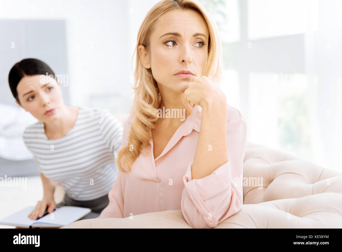 Cheerless gloomy woman feeling depressed Stock Photo - Alamy