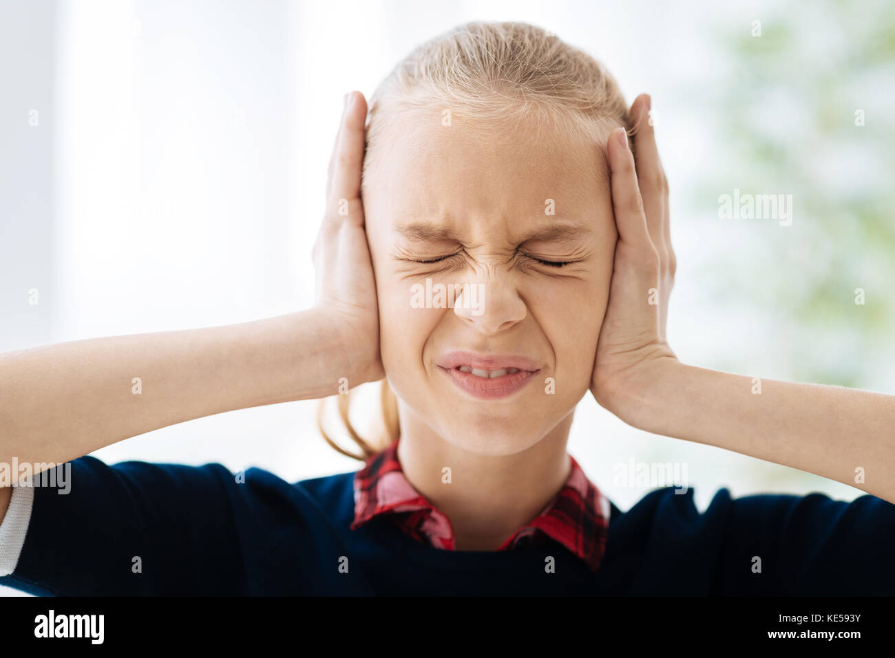 Angry blonde girl being stressed out Stock Photo - Alamy