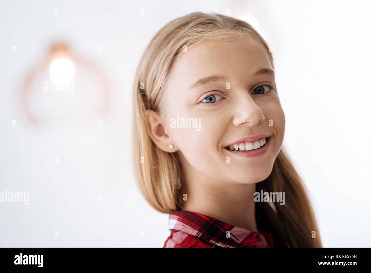 Cheerful young girl smiling Stock Photo - Alamy