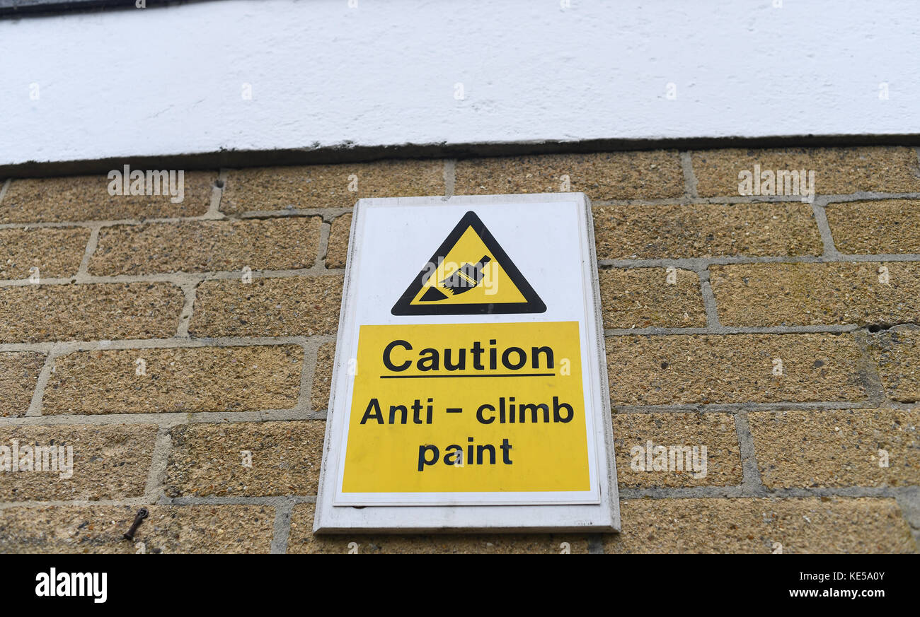 Anti climb paint warning sign Stock Photo - Alamy
