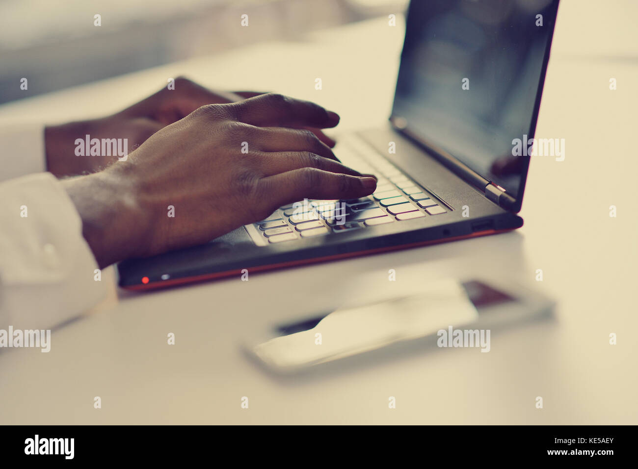 Portrait of an African American typing on the keyboard Stock Photo - Alamy