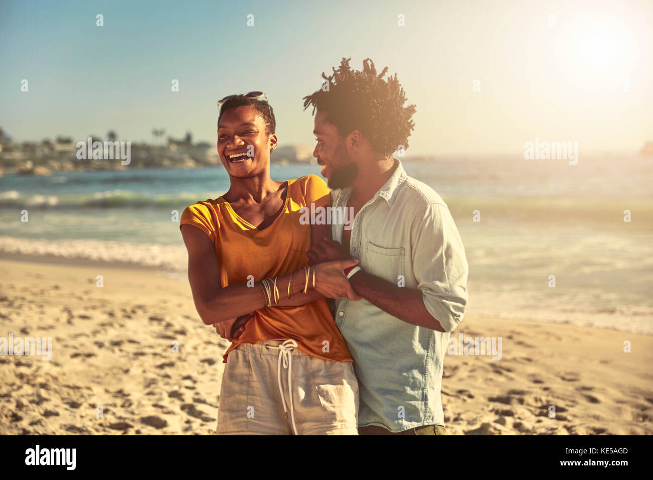 Young woman on a beach laughing hi-res stock photography and images - Alamy