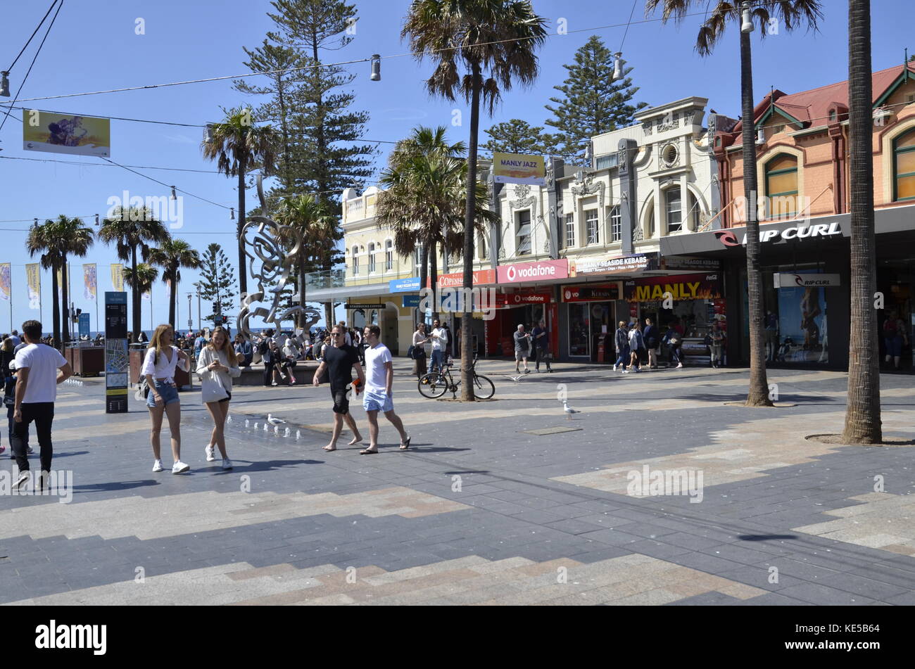 A street scene of The Corso, the main shopping street in Manly, Sydney ...