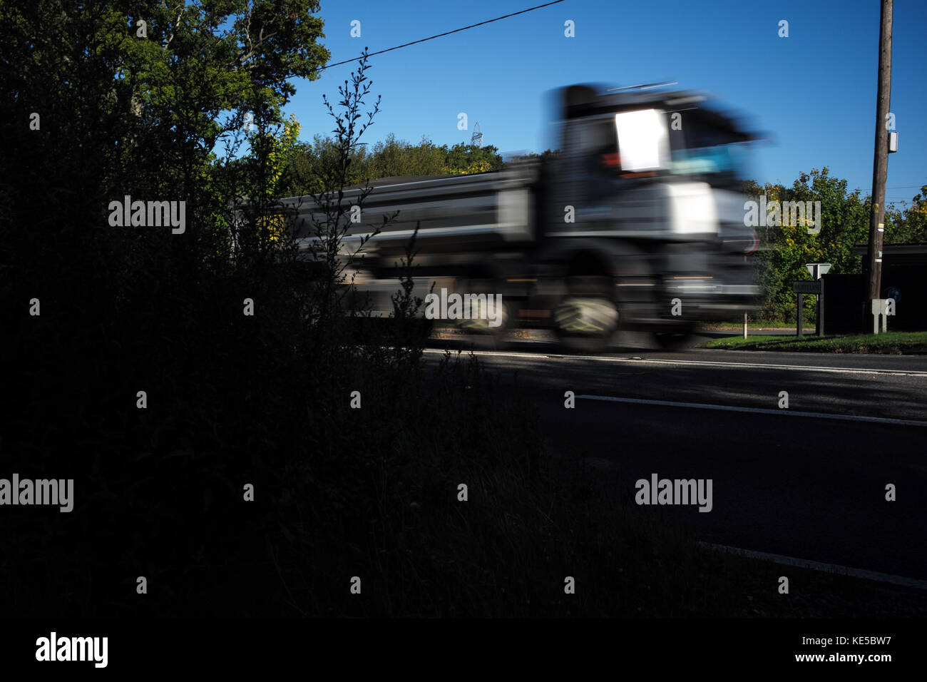 A lorry driving at speed through a 30 MPH zone Stock Photo - Alamy