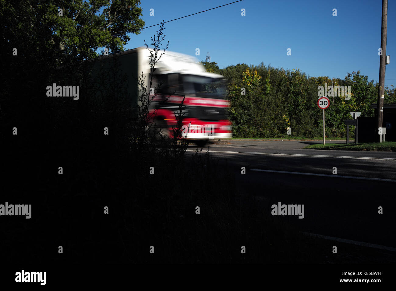 A lorry driving at speed through a 30 MPH zone Stock Photo - Alamy
