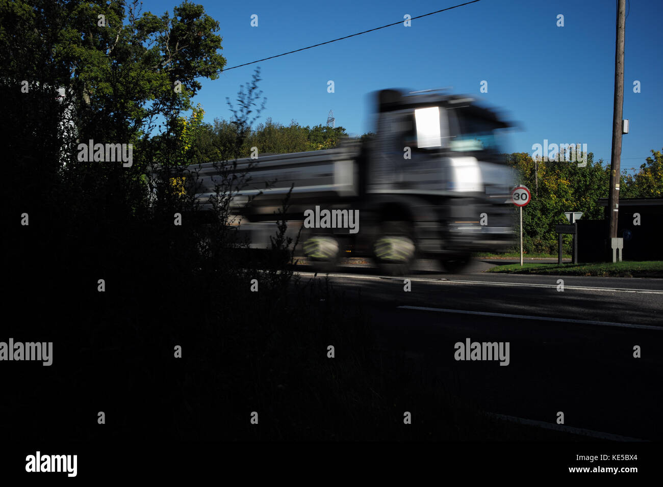 A lorry driving at speed through a 30 MPH zone Stock Photo - Alamy
