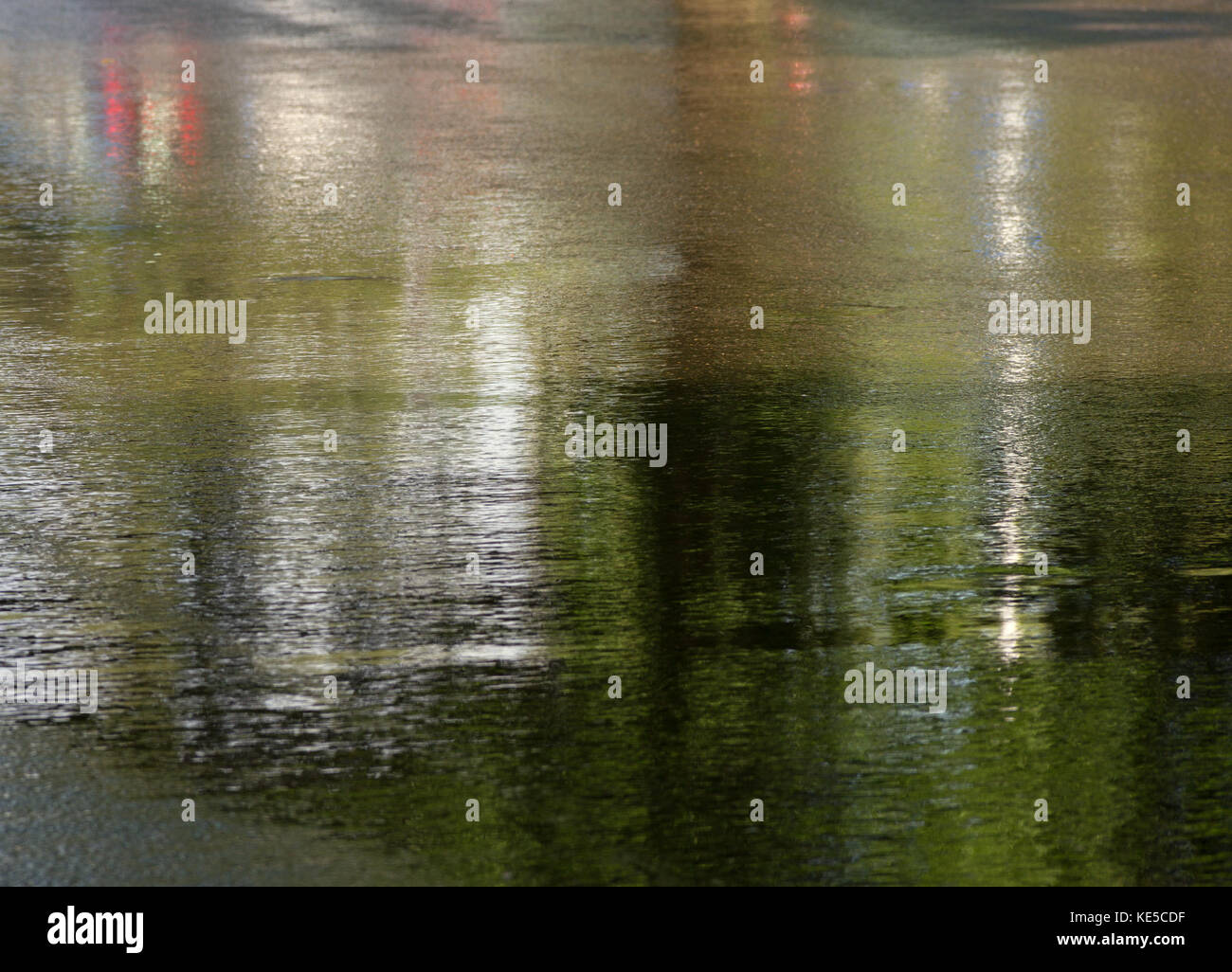Reflection on slippery road after rain Stock Photo - Alamy