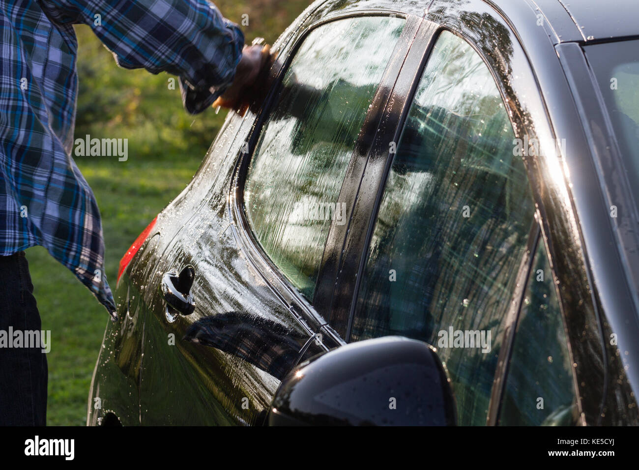 Wash the car by hand Stock Photo - Alamy