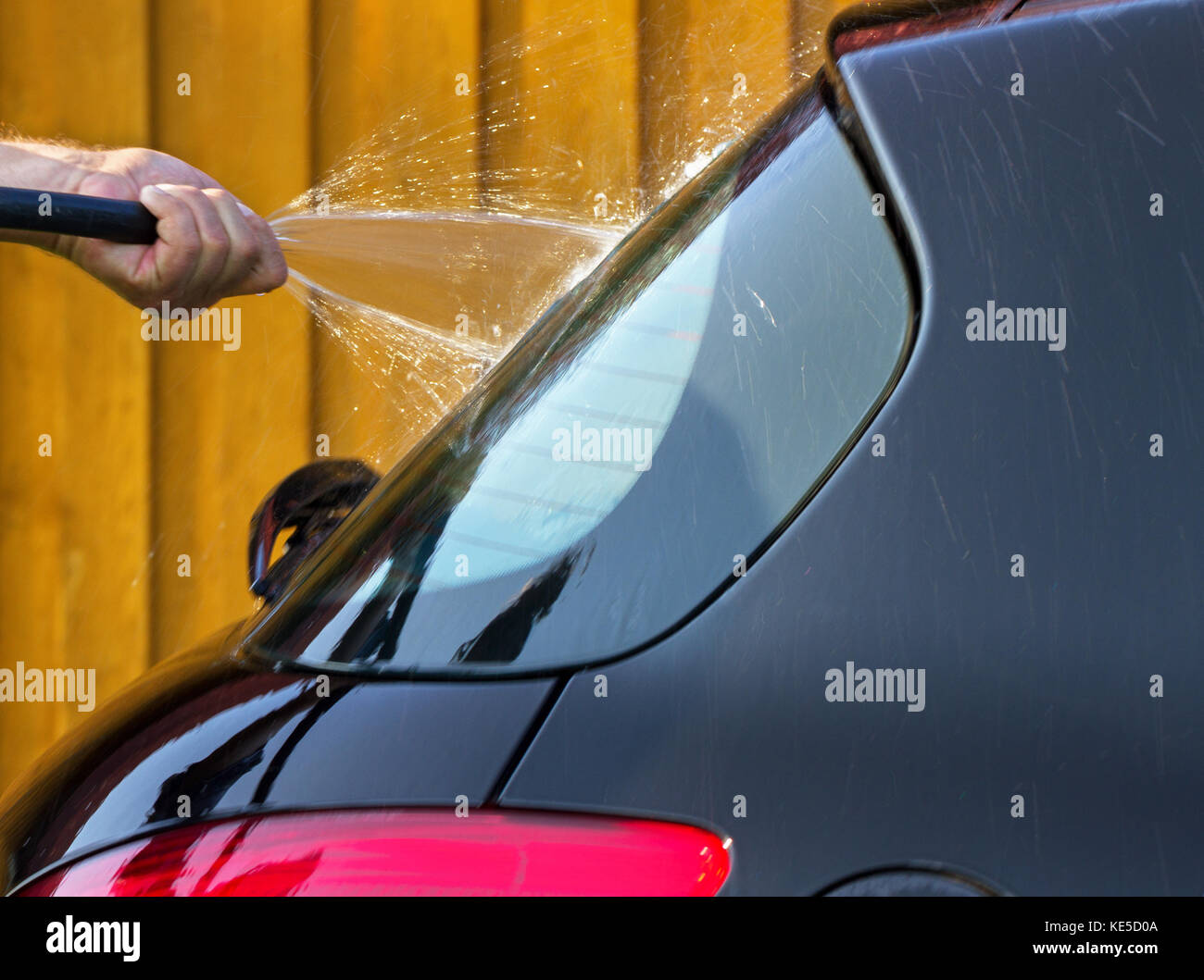 Wash the car by hand Stock Photo - Alamy