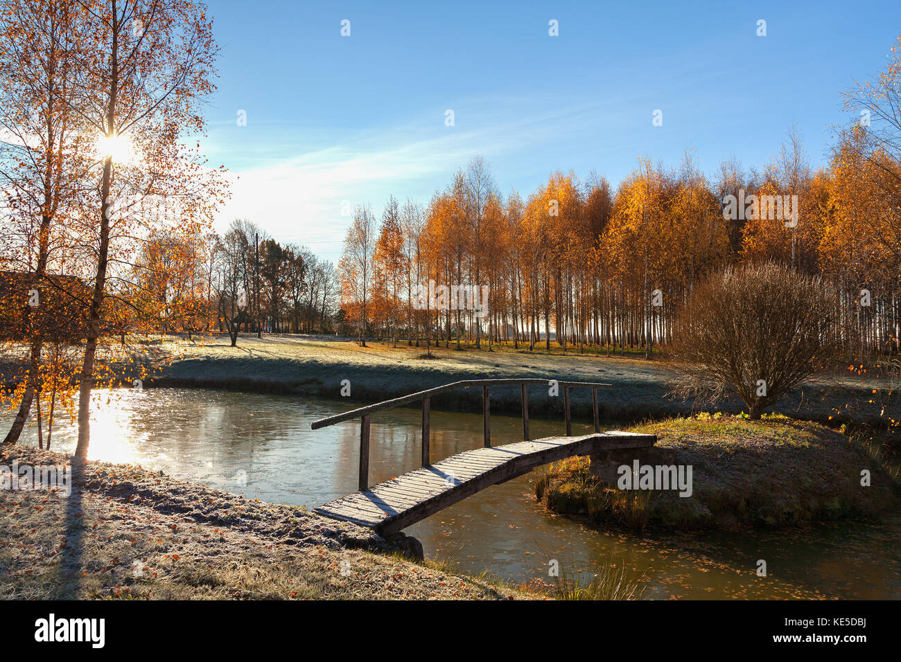 Bridge across the lake in an autumn season Stock Photo - Alamy