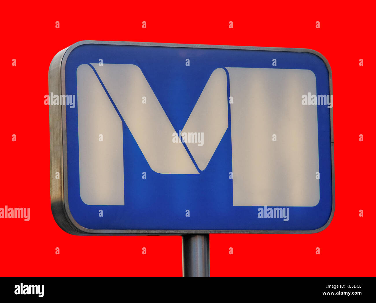 Metro station sign isolated on red surface Stock Photo - Alamy