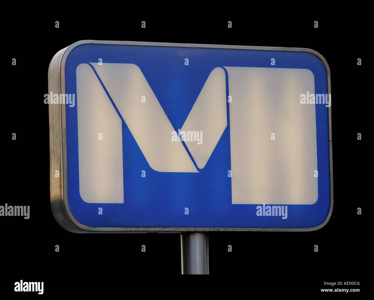 Metro station sign isolated on black surface Stock Photo - Alamy