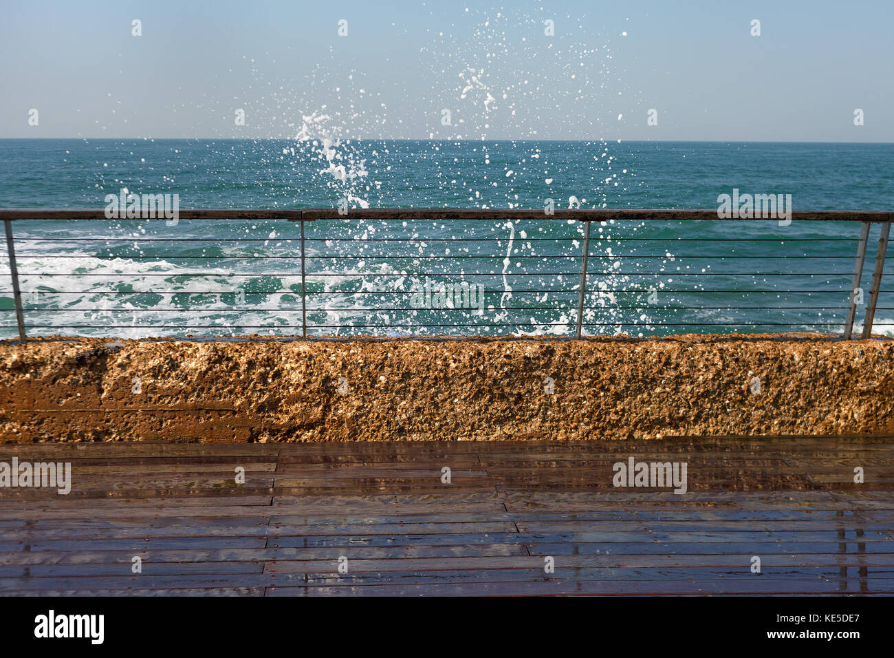 Water splash and slippery promenade at the Mediterranean sea in Tel ...