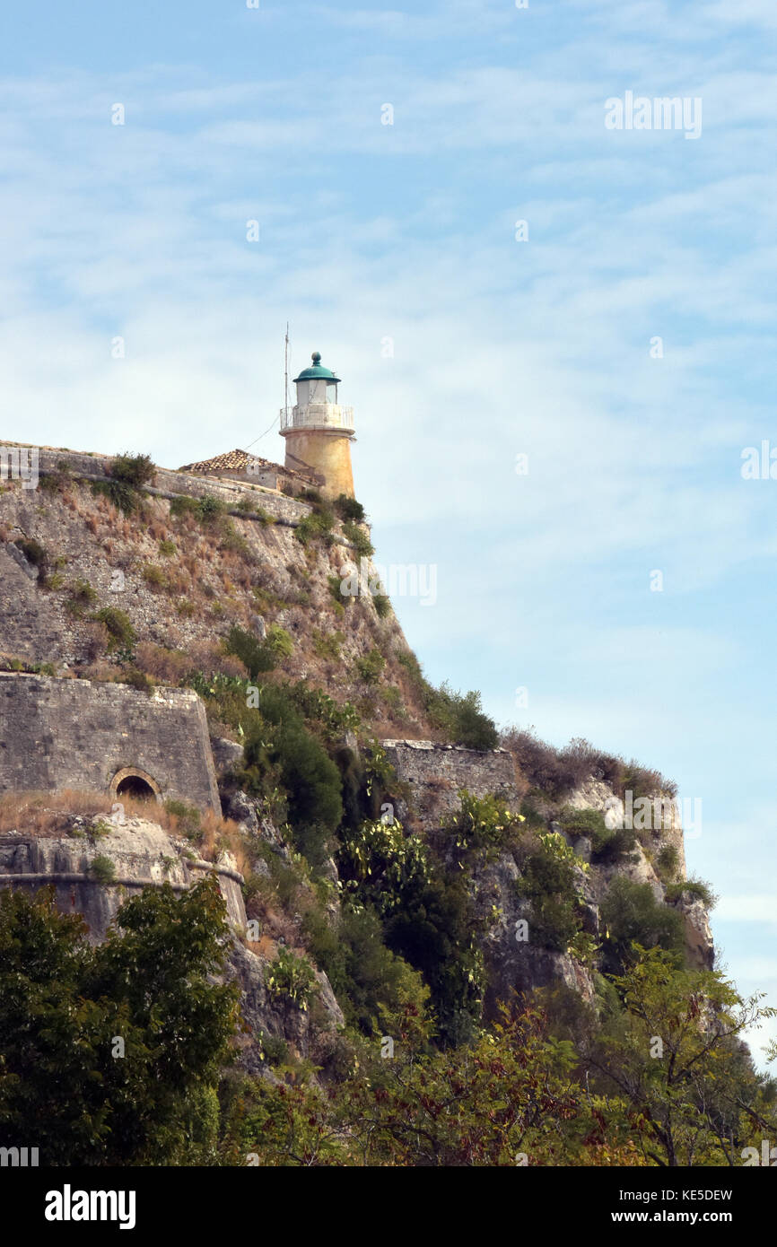 the lighthouse on a rock at the entrance to Kerkira, corfu, Greece with ...