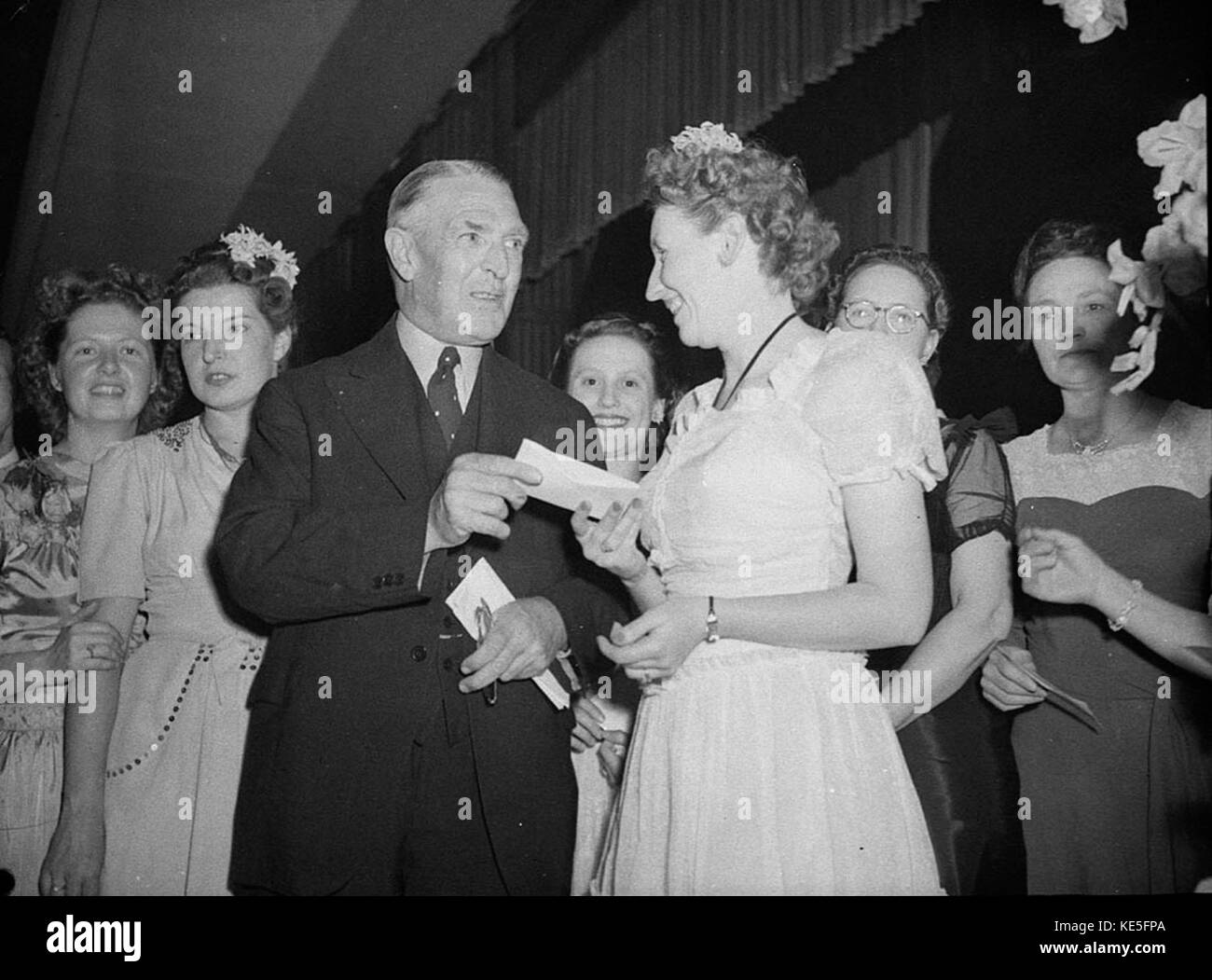 25910 Grace Bros presentation of prizes and cheques Stock Photo - Alamy