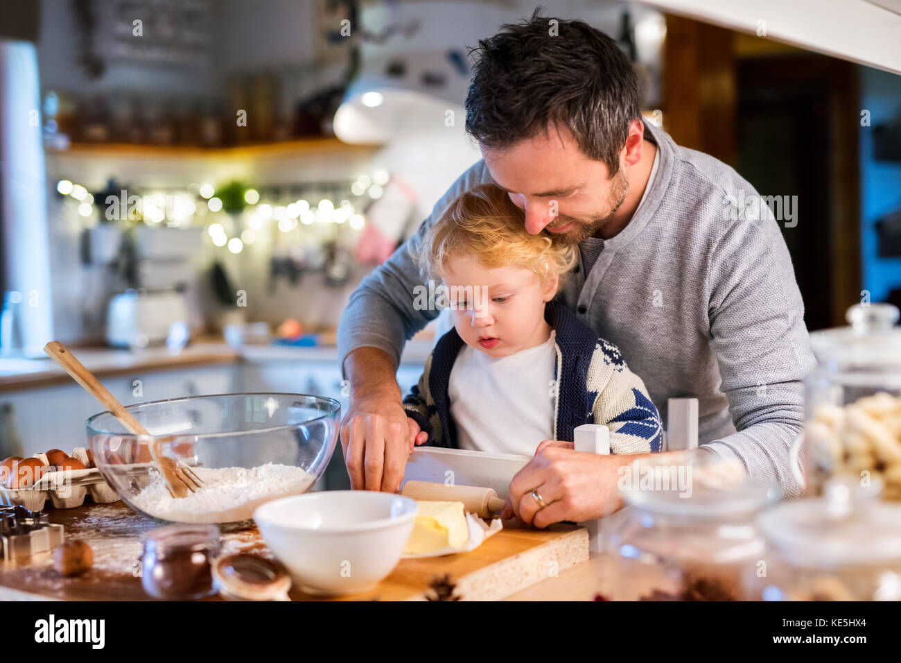 Young family making cookies at home Stock Photo - Alamy