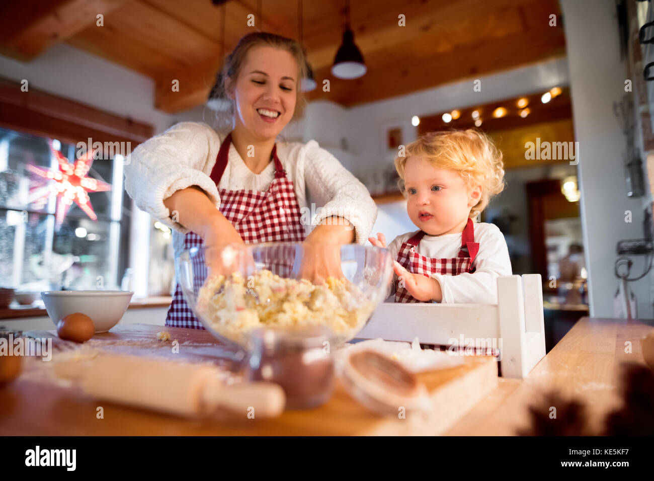 Young family making cookies at home Stock Photo - Alamy