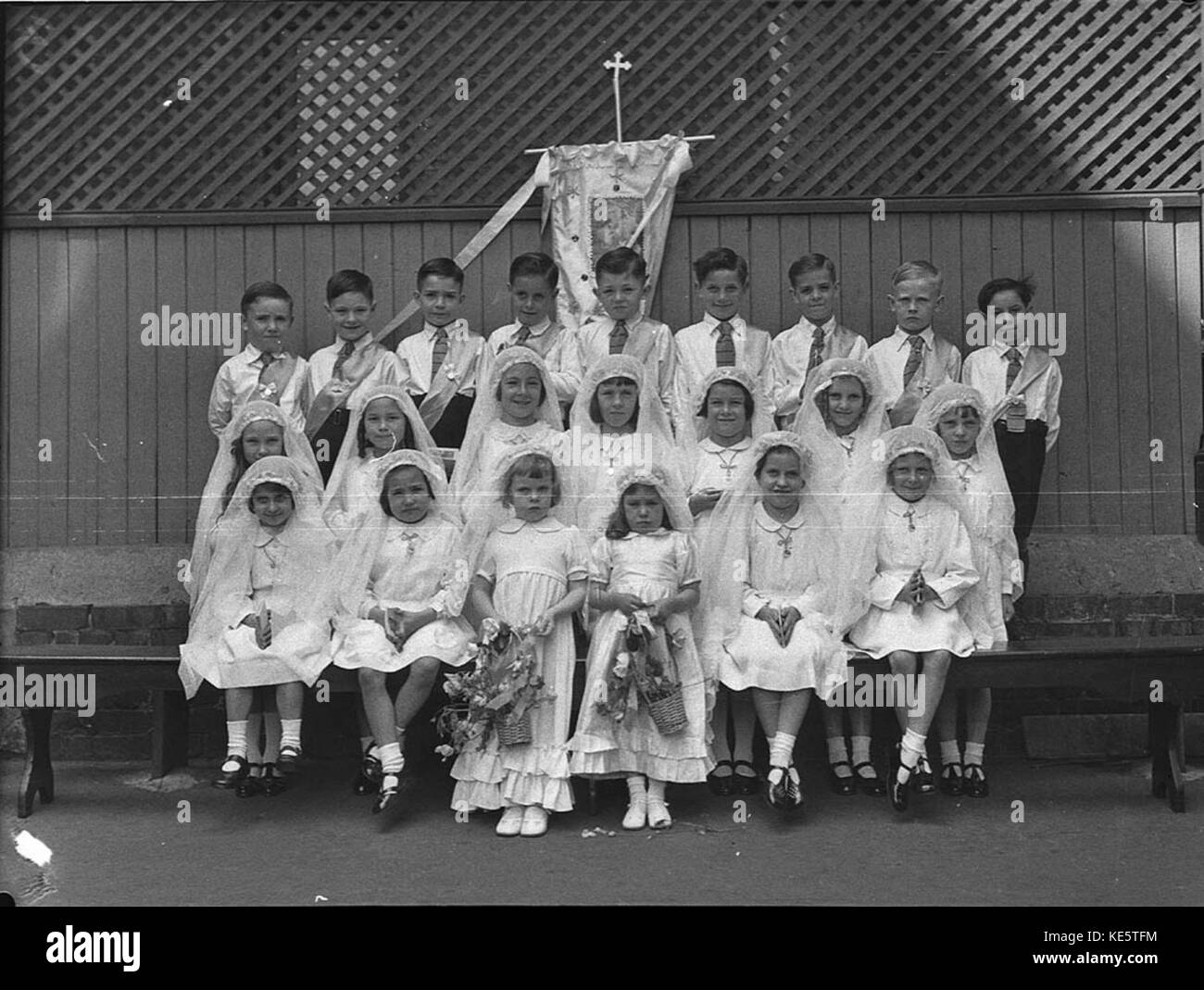 A historic photograph of a first communion at St. Francis Convent. The ...