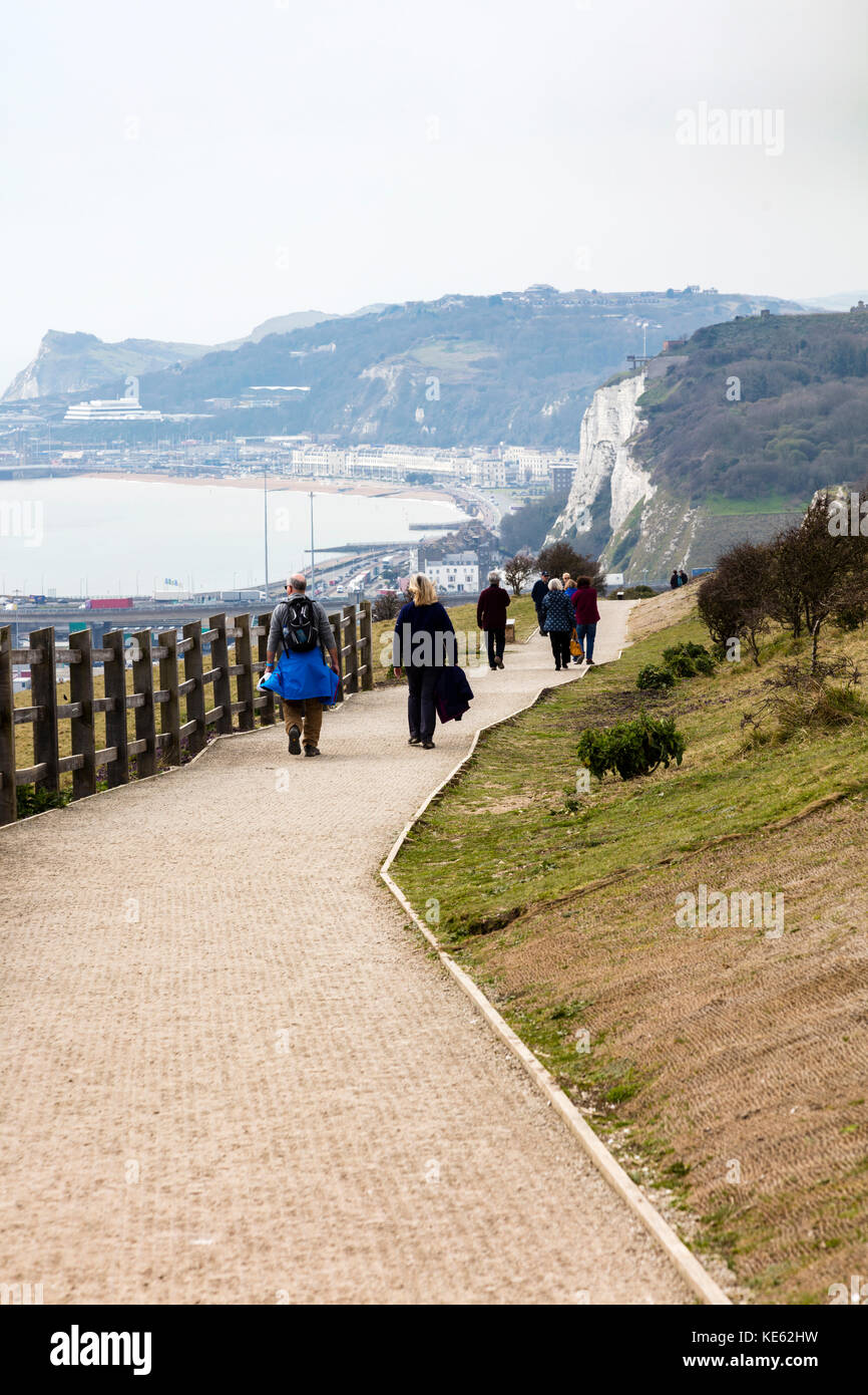 Visitors to the White Cliffs of Dover, walk down a path towards the ...