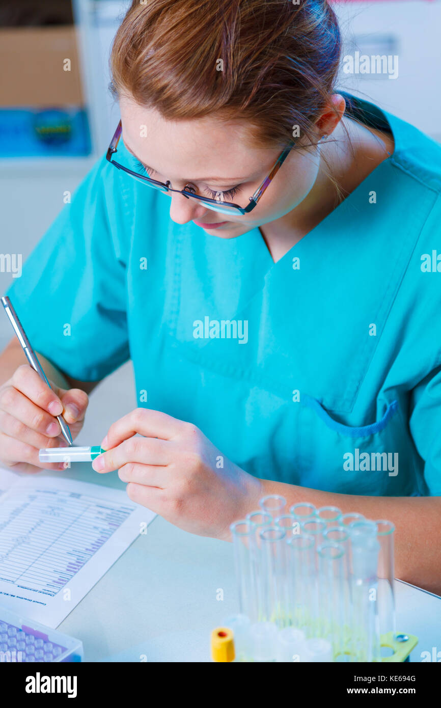 Nurse doing medical analysis Stock Photo - Alamy