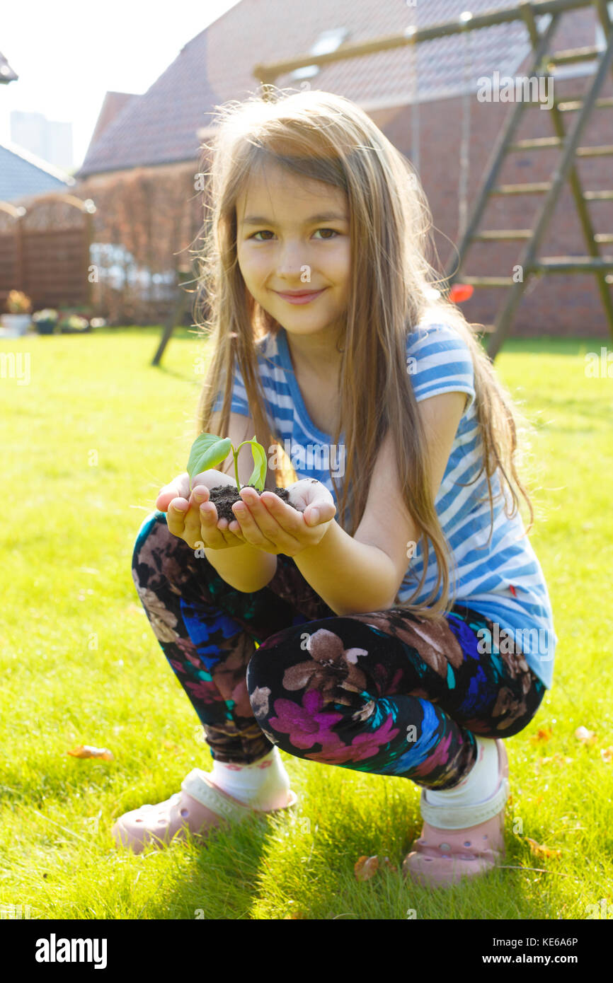 Girl planting tree hi-res stock photography and images - Alamy