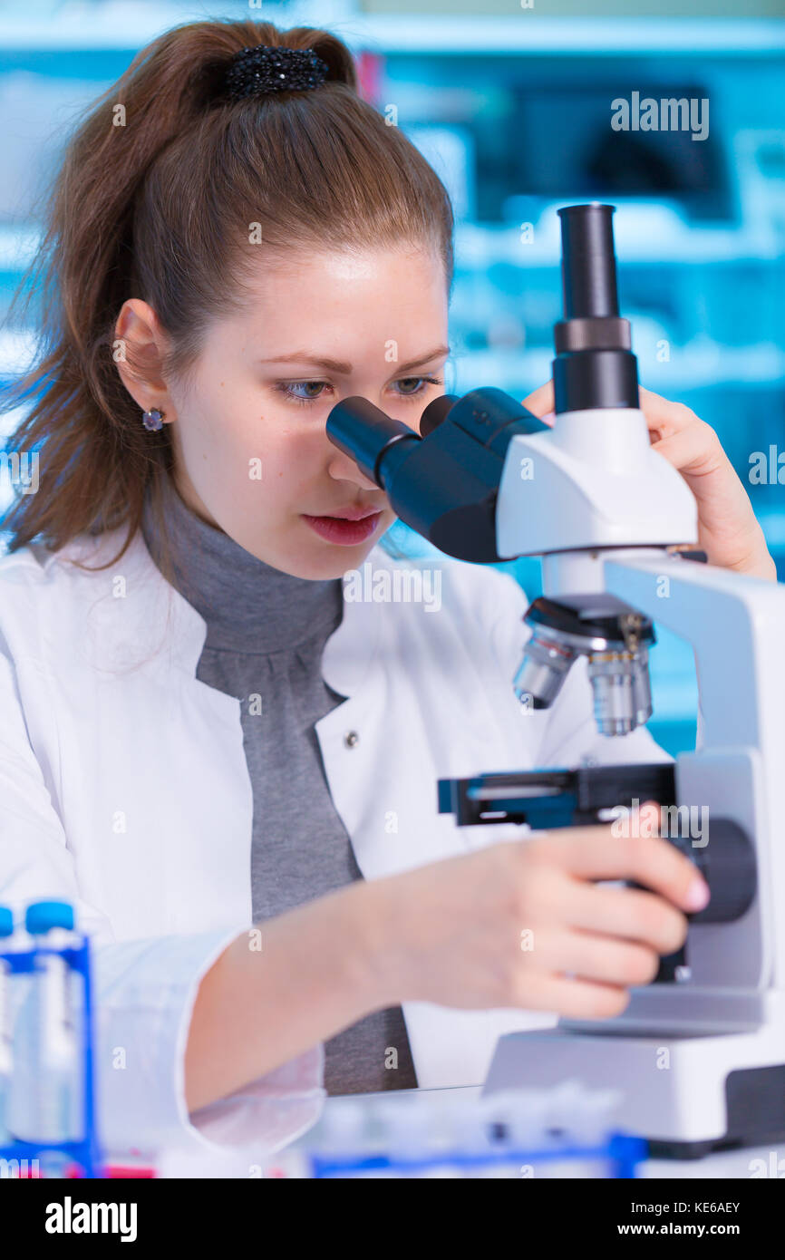 laboratory female assistant with pipette Stock Photo - Alamy