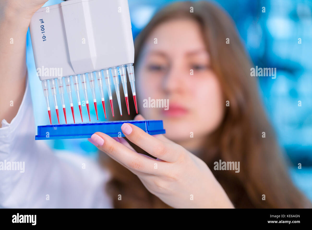 laboratory female assistant with pipette Stock Photo - Alamy