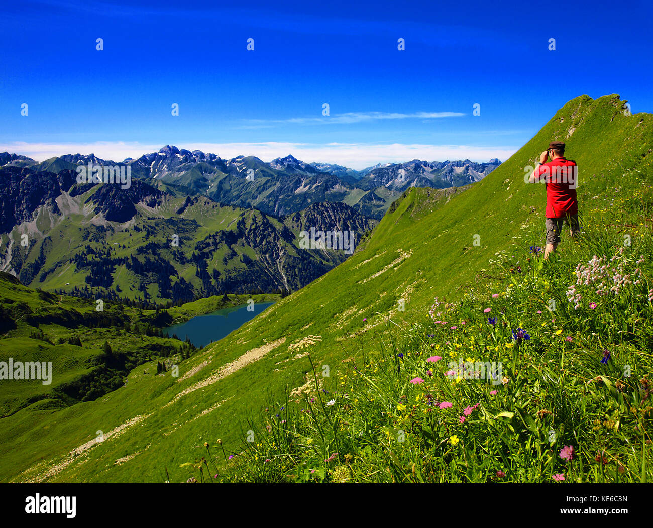 Hiker at the mountain lake, Seealpsee, Allgäu Alps, Bavaria, Oberstdorf ...