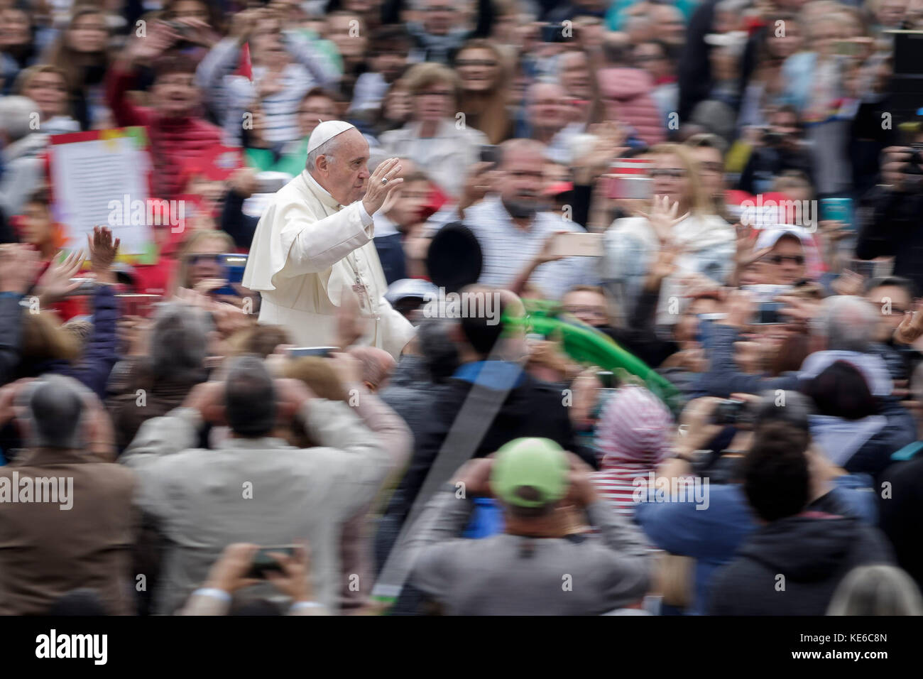 Vatican City, Vatican. 18th Oct, 2017. Pope Francis rides on the ...