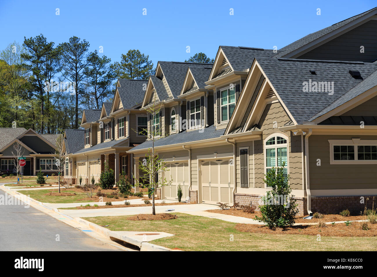 A row of modern townhouses in a new subdivision Stock Photo - Alamy