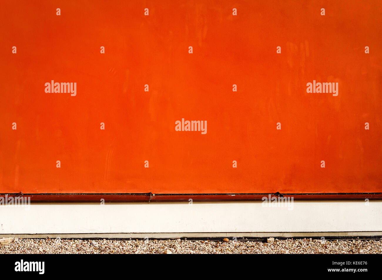 Newly built orange wall and ground. Architecture detail background ...