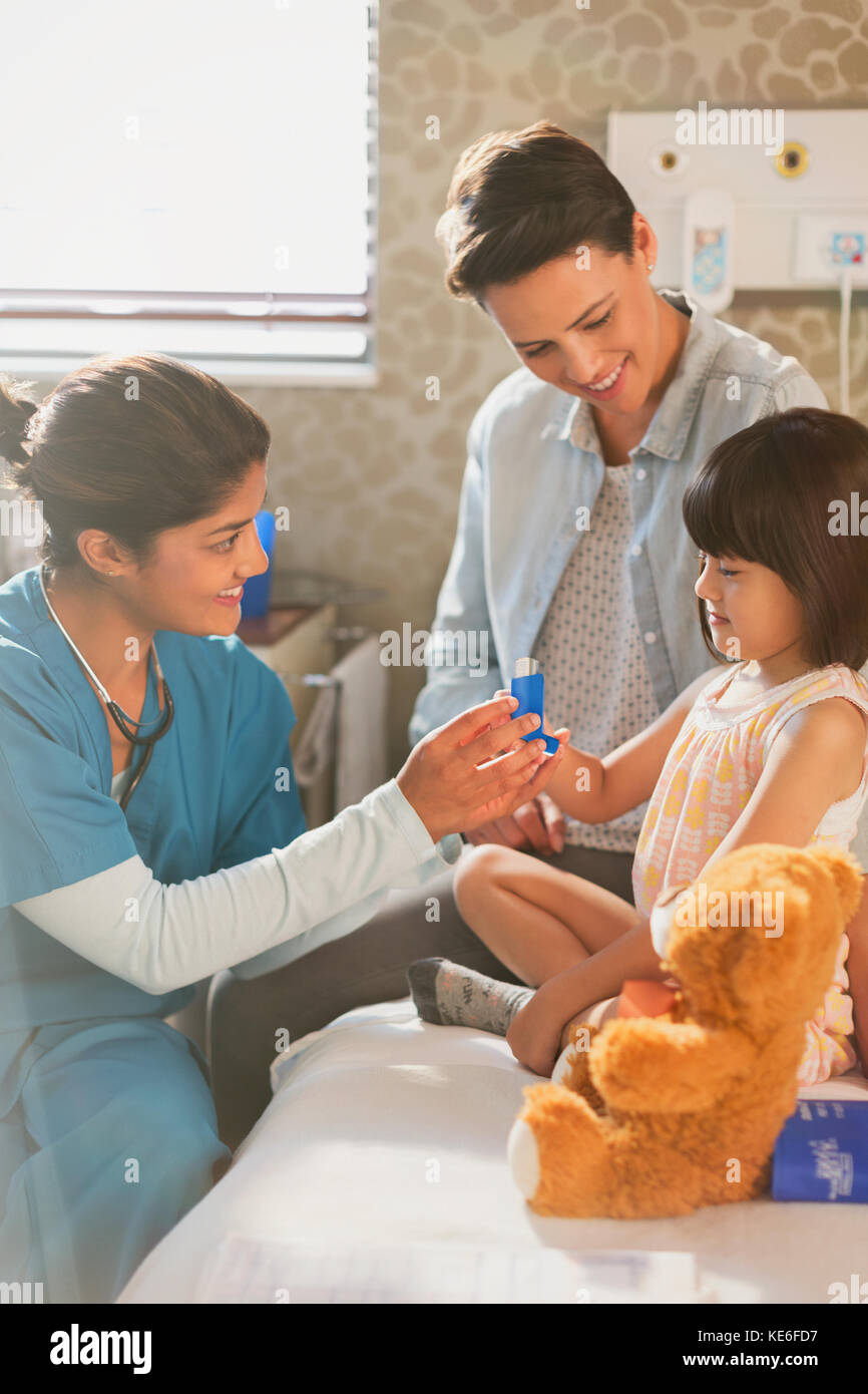 A child using an inhaler for the treatment of asthma hi-res stock ...