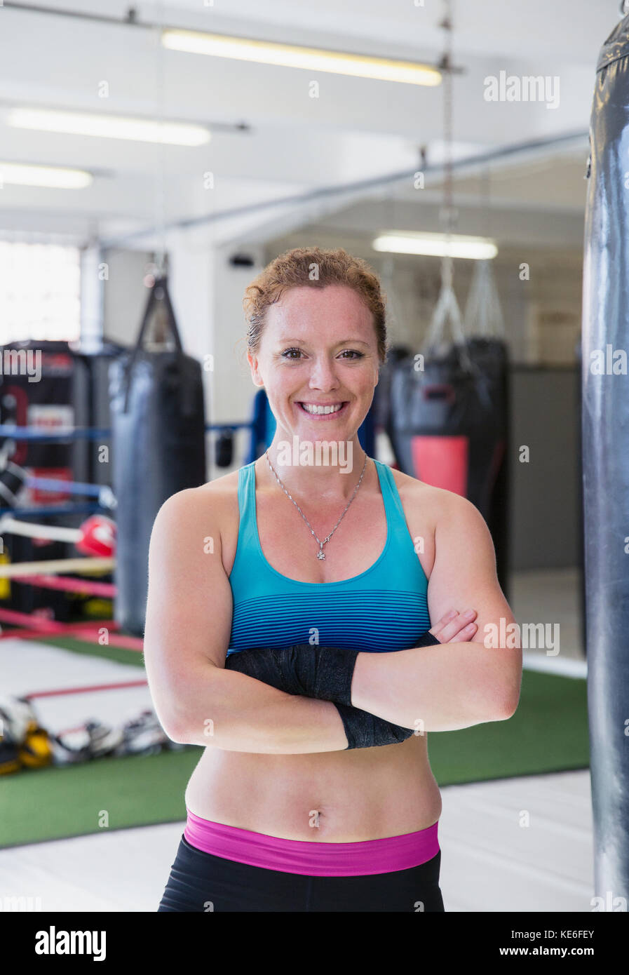 Portrait confident, smiling female boxer in gym Stock Photo - Alamy
