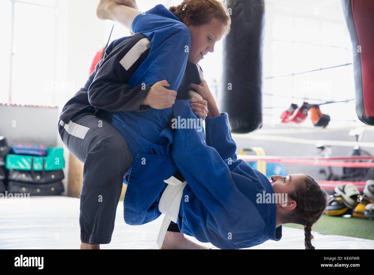 Determined women practicing judo in gym Stock Photo - Alamy
