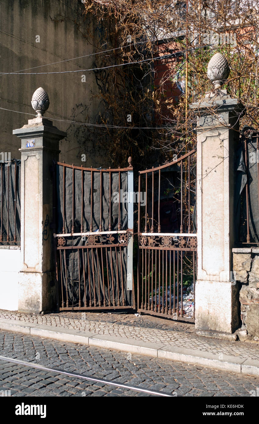 Old and ruined gate entrance in front of a private property Stock Photo ...