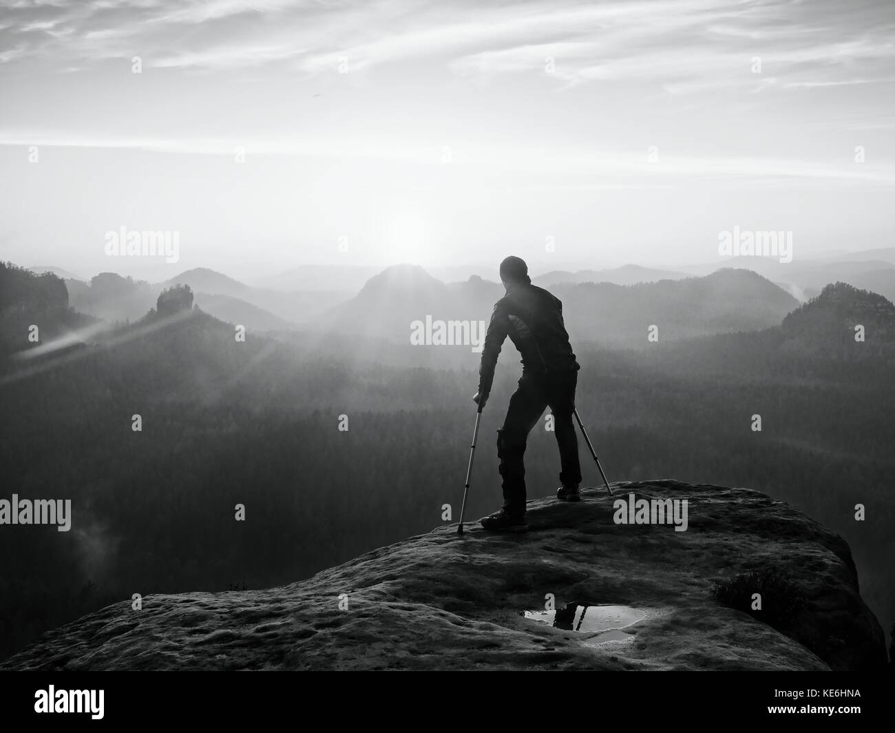 Bended man with broken leg and medicine crutch. Hiker with leg in ...