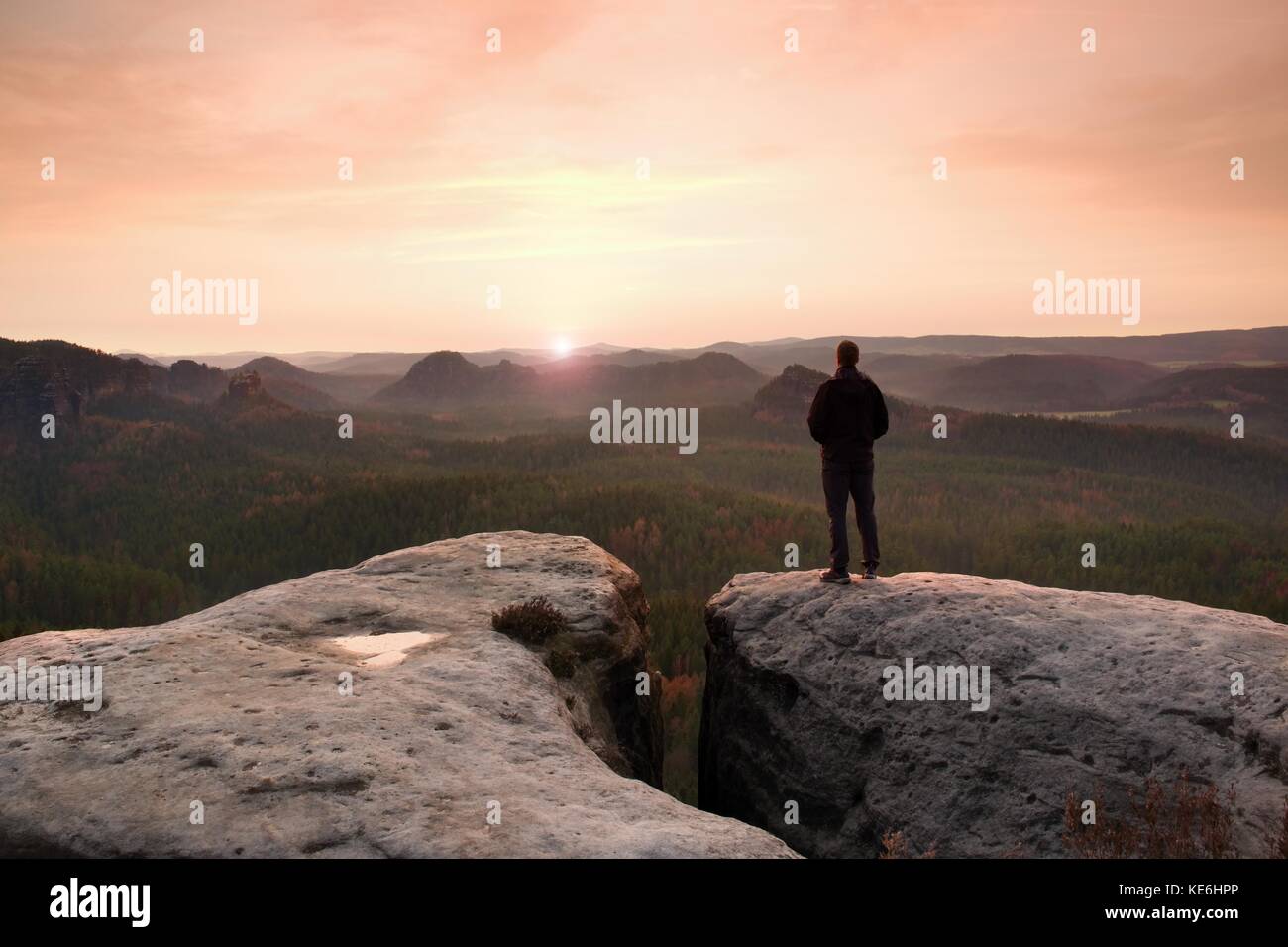 Hiker on the peak of sandstone rock in rock empires park and watching ...
