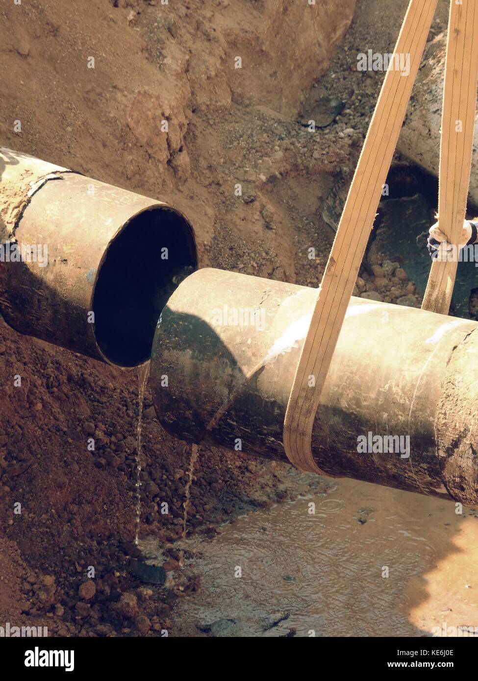 Rusty Old Iron Pipe With Clear Water Flowing From It. Waste water drain ...