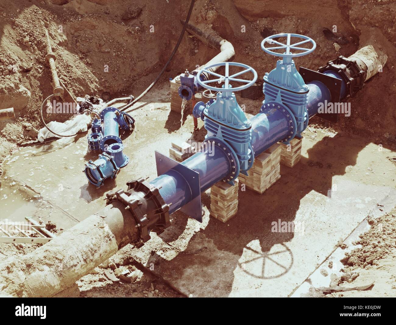 Oil, gas, water industry. Wellhead with valve armature underground. Dug ...